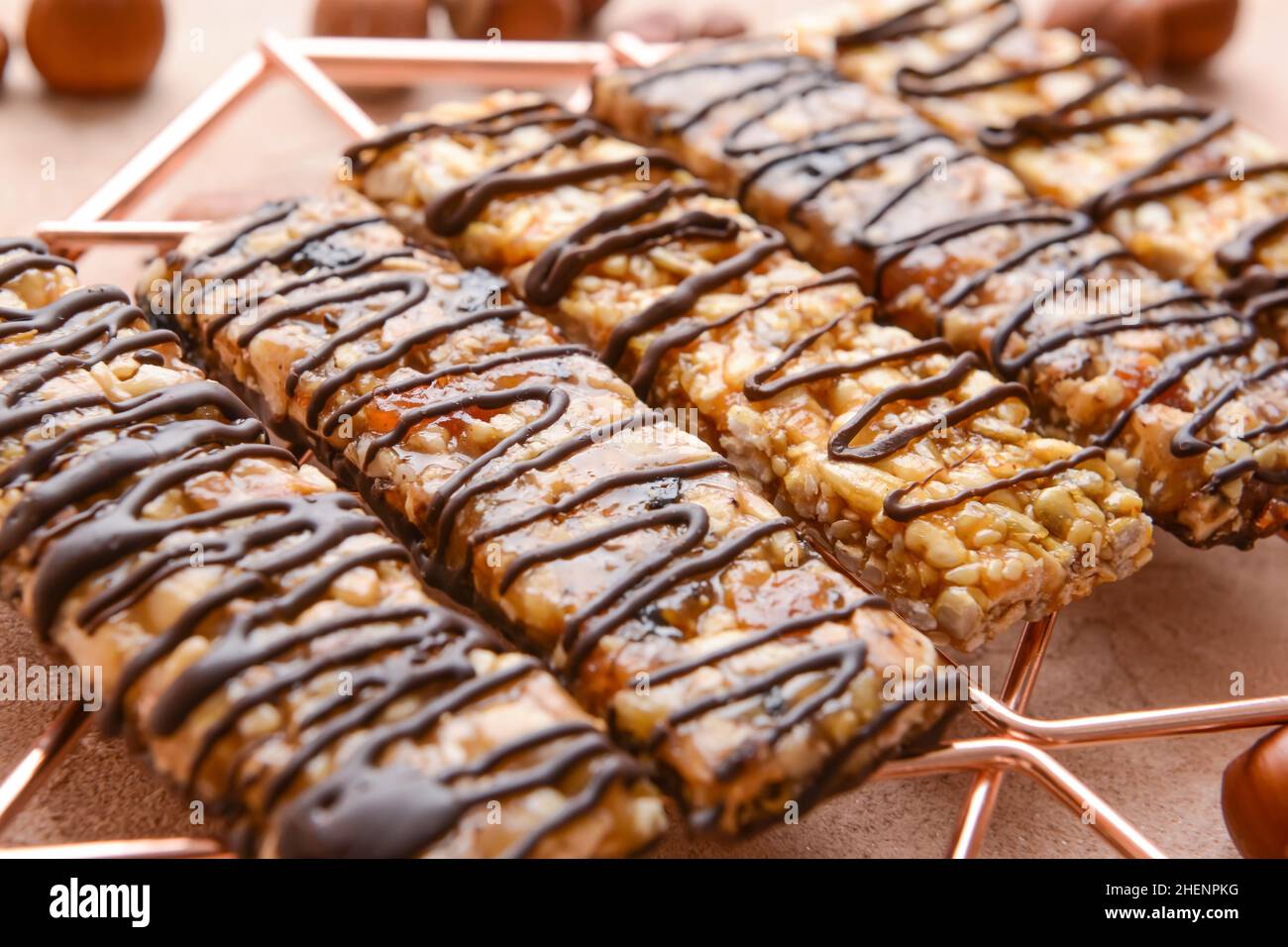 Rack with tasty chocolate nut bars, closeup Stock Photo - Alamy