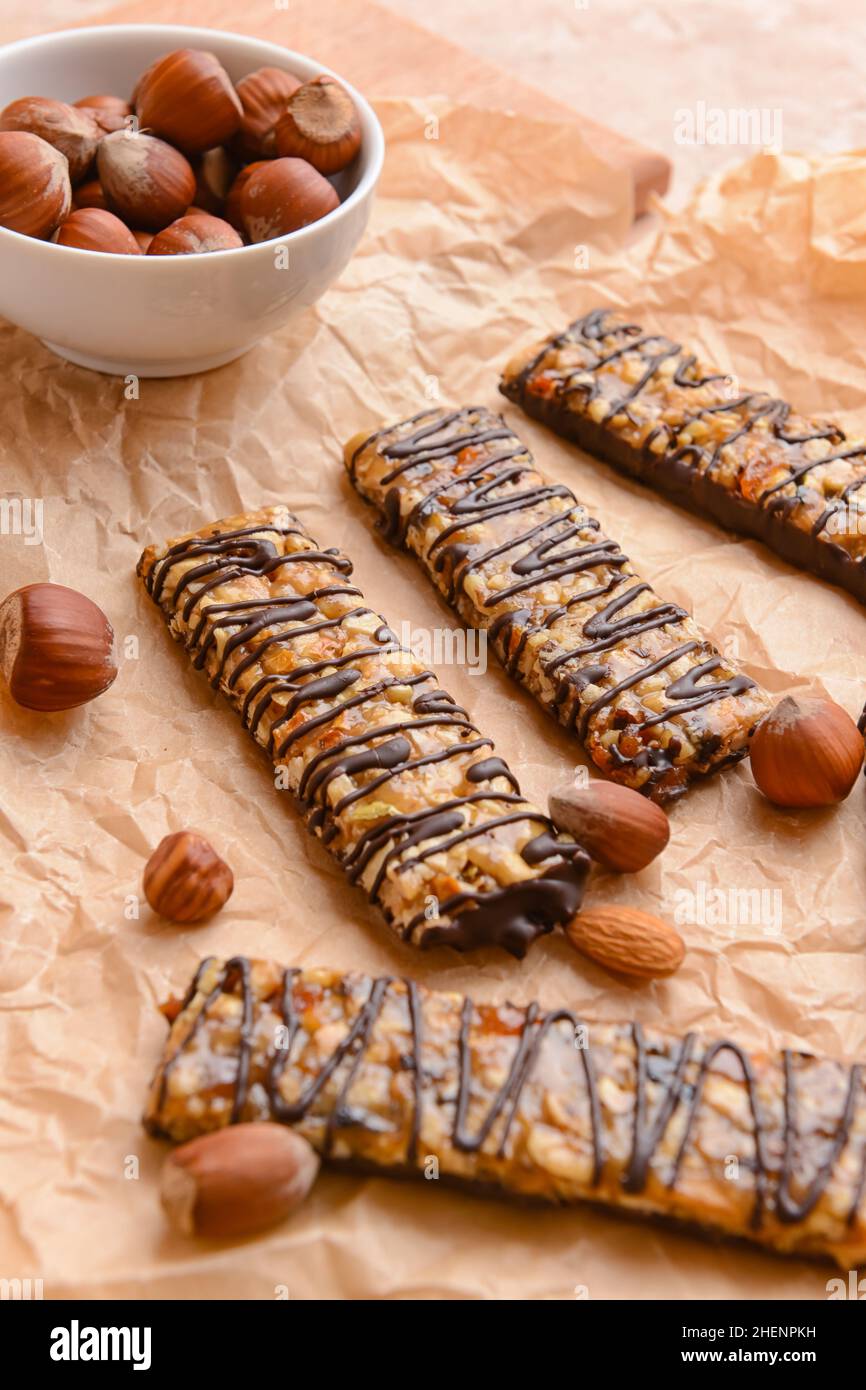 Tasty chocolate nut bars on parchment Stock Photo - Alamy