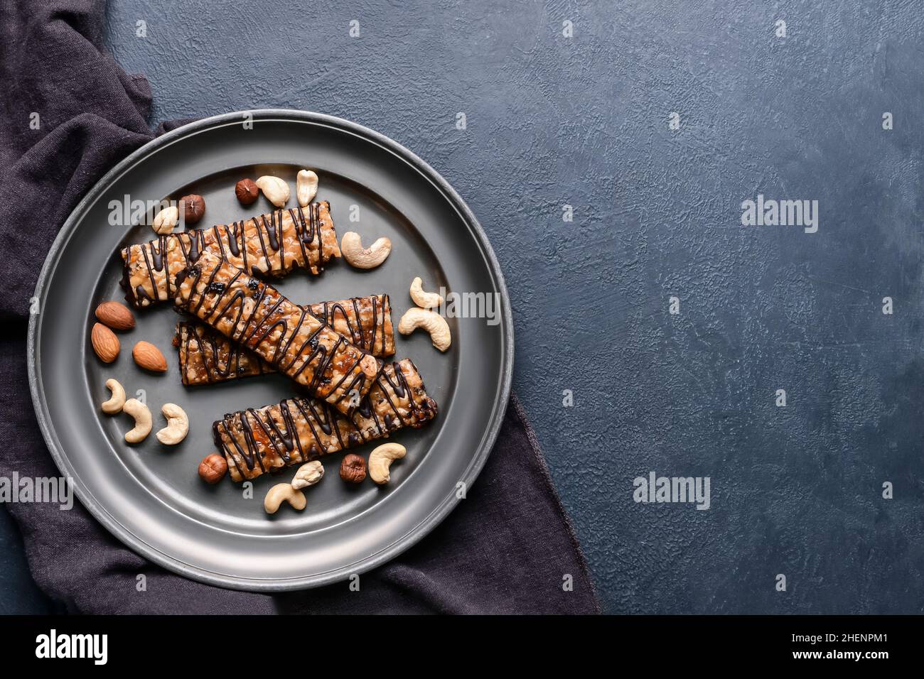 Tray with tasty chocolate nut bars on dark background Stock Photo - Alamy