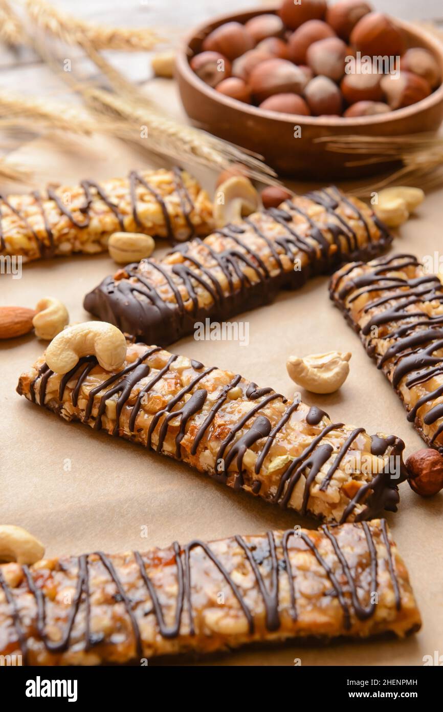 Tasty chocolate nut bars on parchment Stock Photo - Alamy