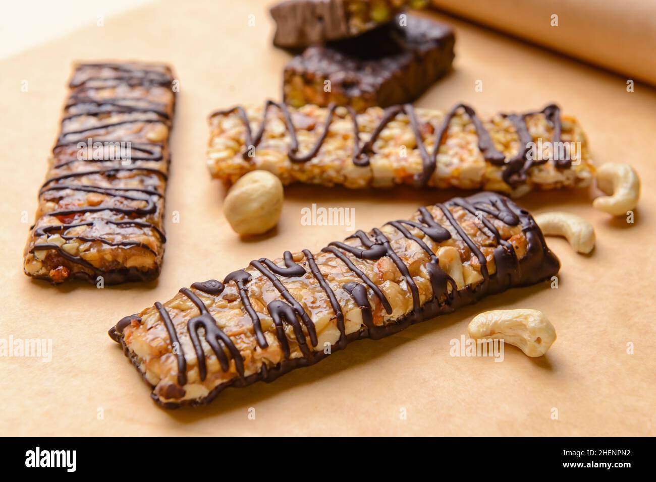 Tasty chocolate nut bars on parchment Stock Photo - Alamy