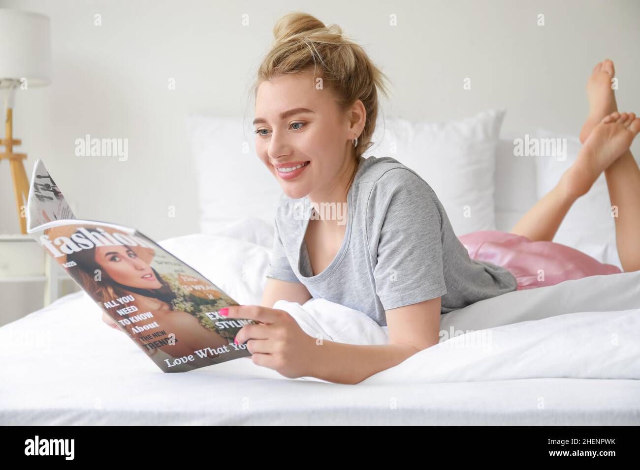 Morning of beautiful woman reading magazine on bed Stock Photo - Alamy