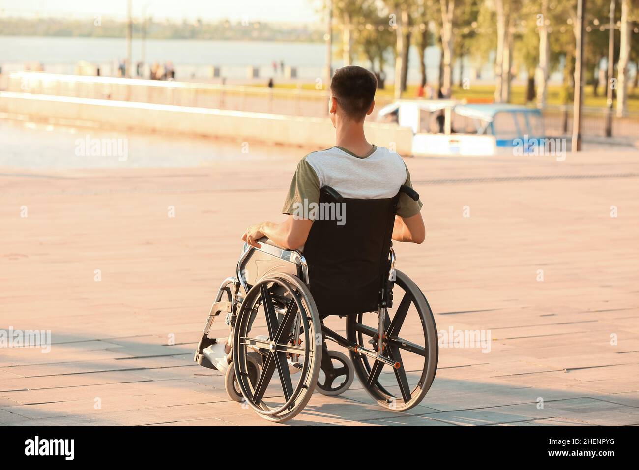Young man with physical disability outdoors Stock Photo - Alamy
