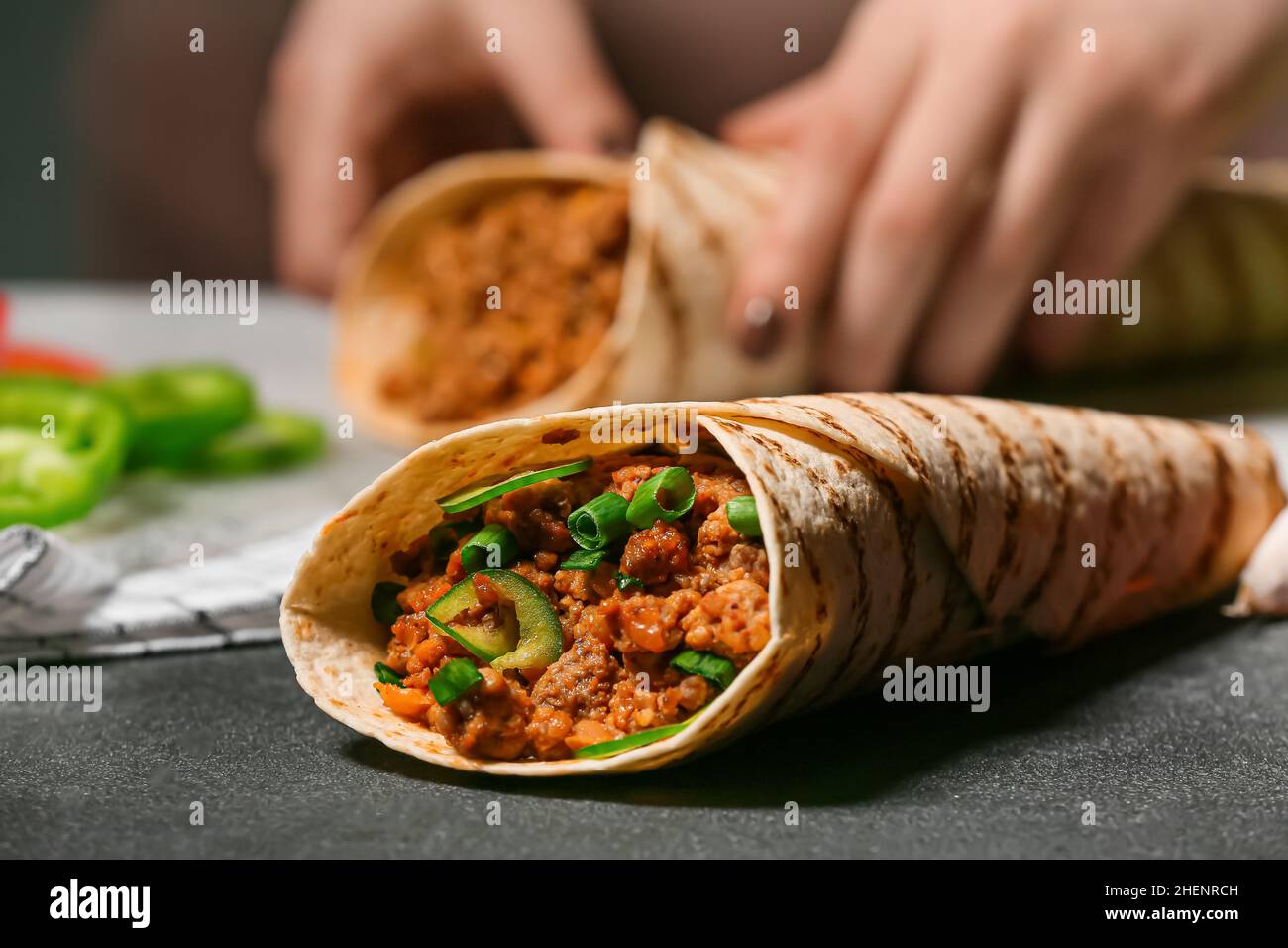 Eating burrito person hi-res stock photography and images - Alamy