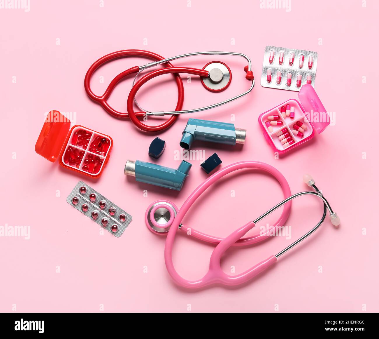 Asthma inhalers, stethoscopes and pills on pink background Stock Photo ...
