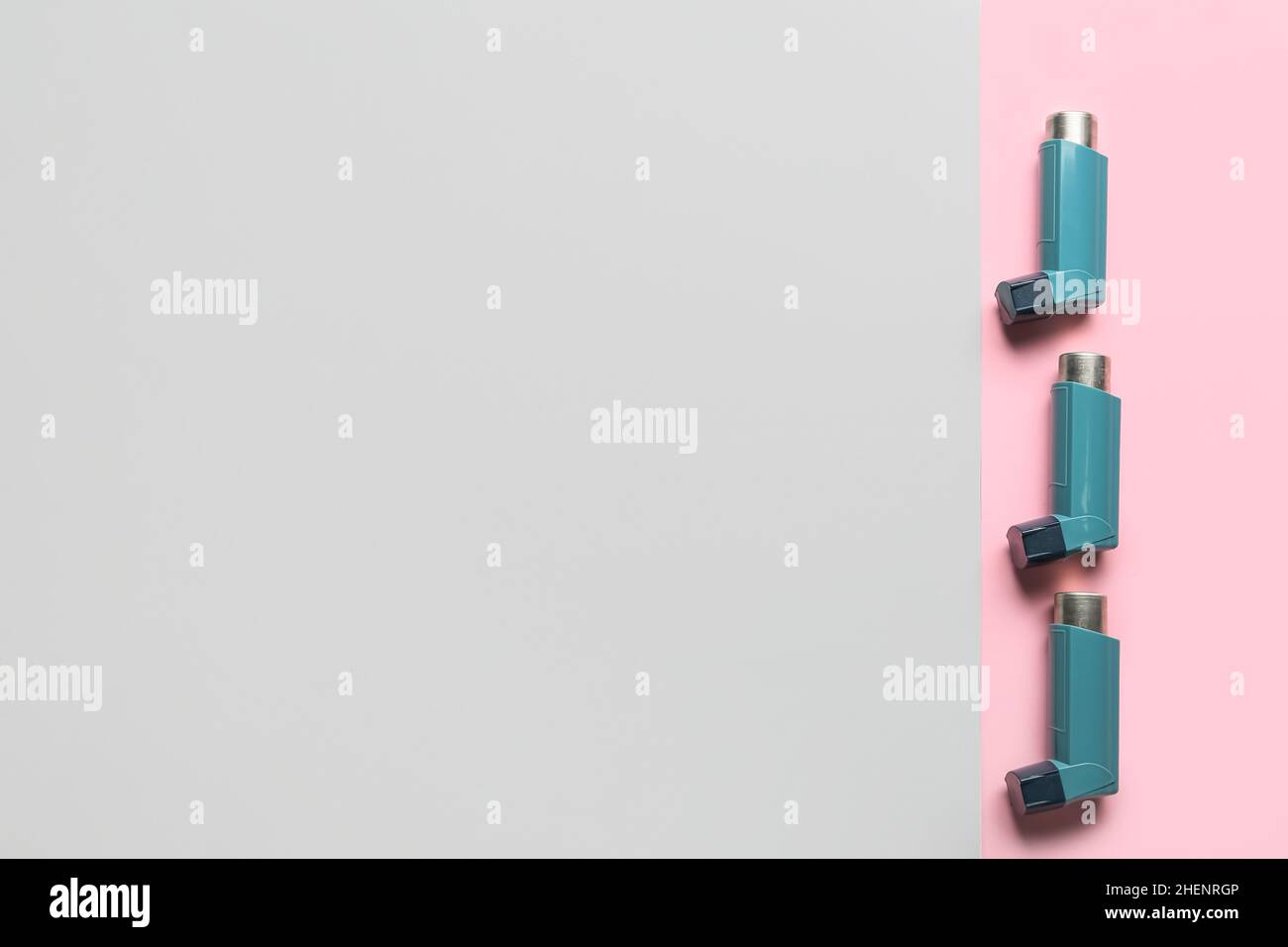 Asthma inhalers on color background Stock Photo - Alamy