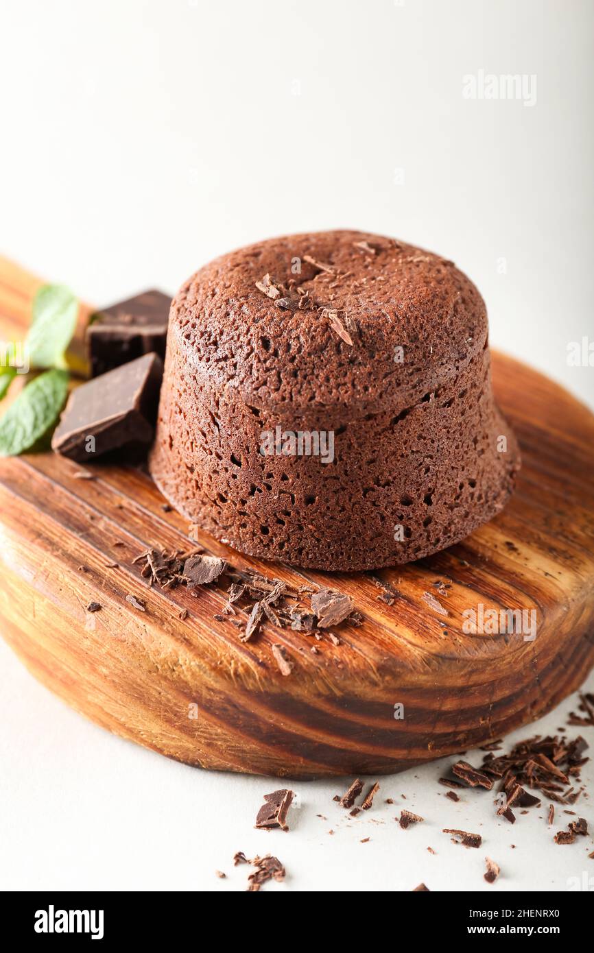 Board with tasty lava cake fondant on white background, closeup Stock ...