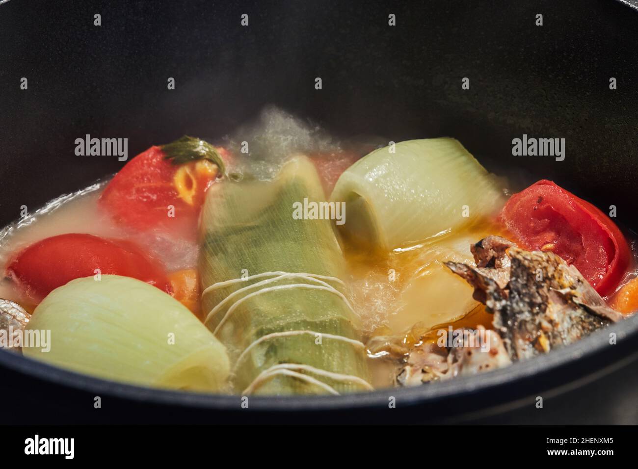 Vegetables boiling in saucepan with steam close-up Stock Photo - Alamy