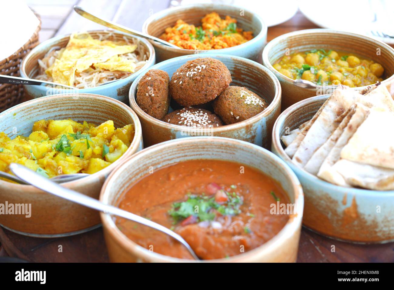 Bahrain breakfast of flat bread, foul medames, eggs, chickpeas, falafel ...
