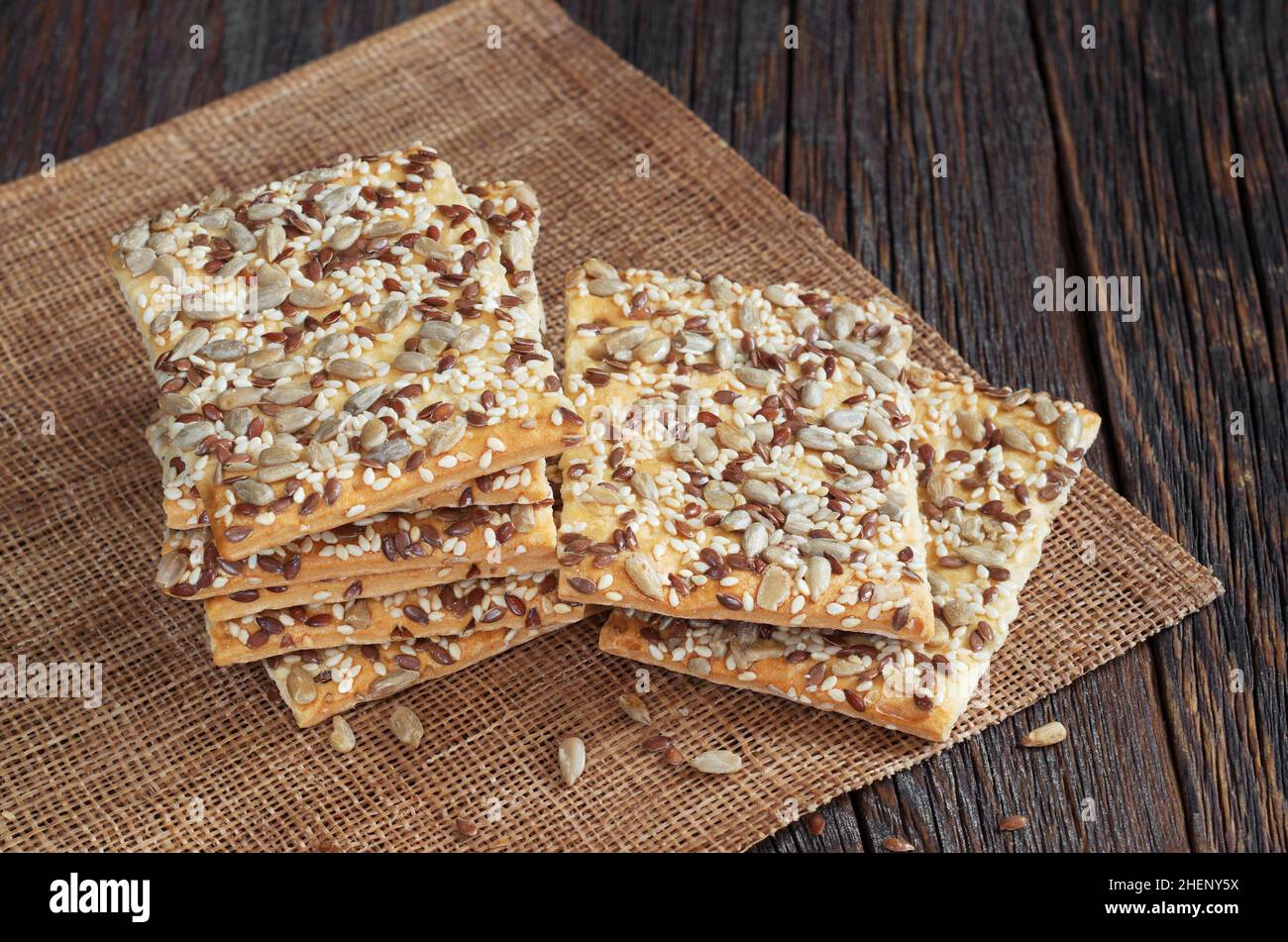 Rectangular cookies with sunflower seeds and sesame on old wooden table ...