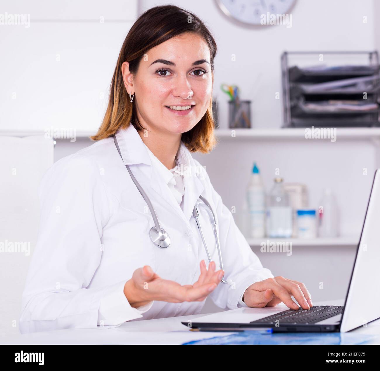 Female doctor offering help Stock Photo - Alamy