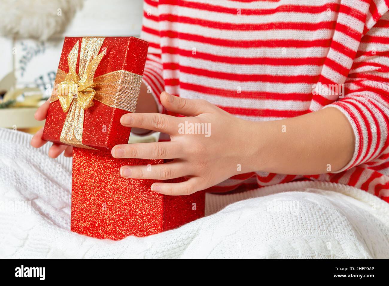 Hand opening red gift box hi-res stock photography and images - Alamy