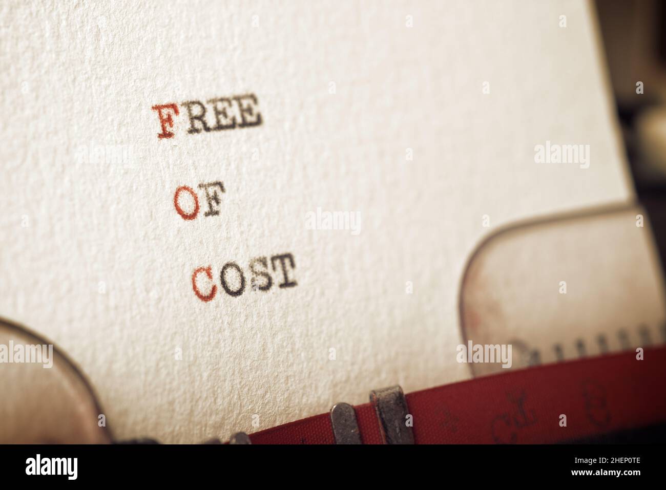 Free of cost text written with a typewriter Stock Photo - Alamy