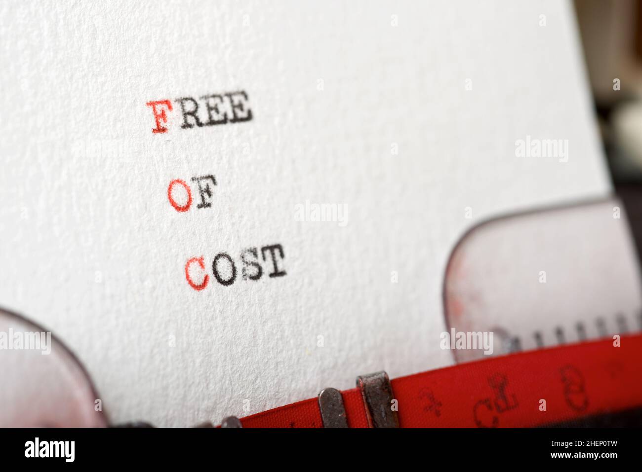 Free of cost text written with a typewriter Stock Photo - Alamy