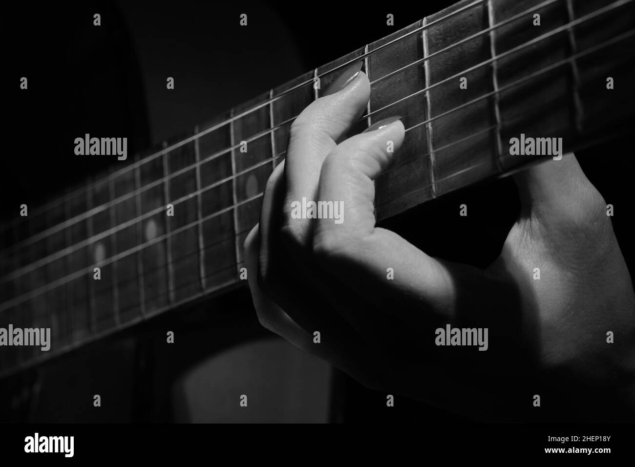 Female musician playing an acoustic guitar Black and White Stock Photos ...