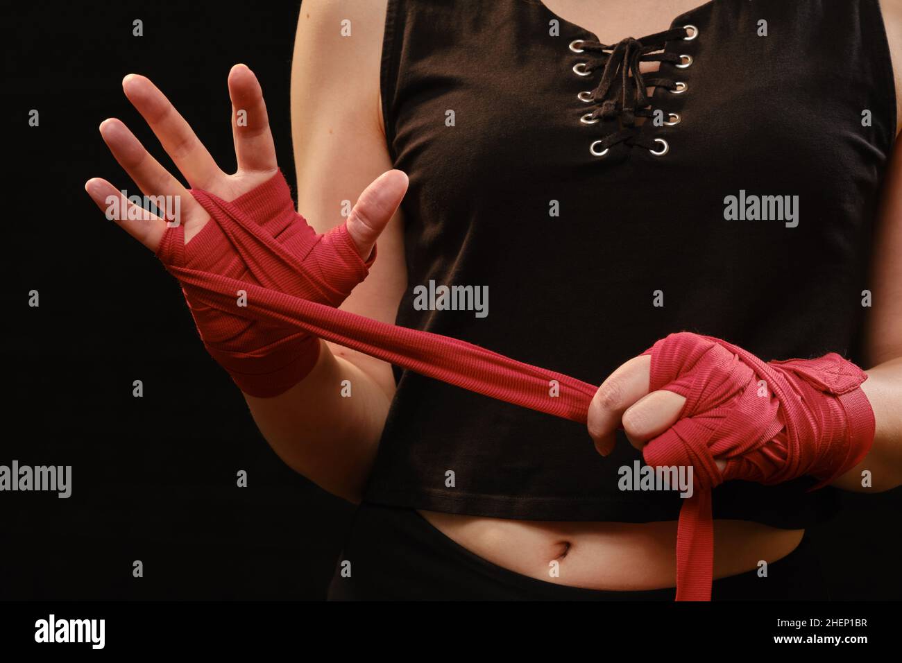 Muay Thai female boxer wearing strap on wrist closeup view. Fitness ...