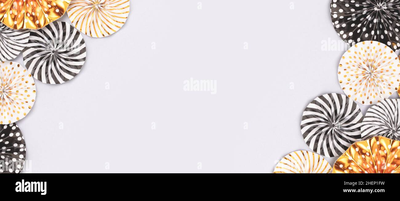 Banner with border frame made of colorful paper fans on a blue ...
