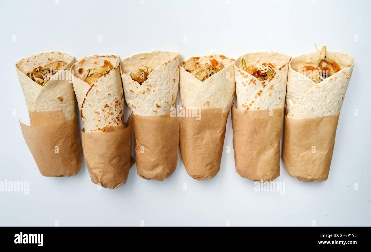 Closeup of burritos isolated on white background Stock Photo - Alamy