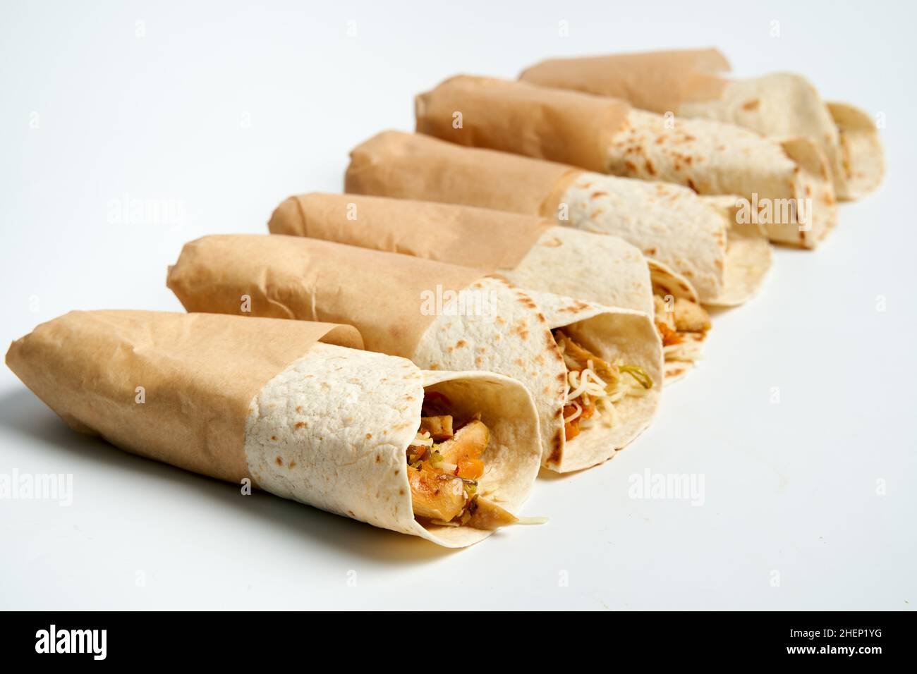 Closeup of burritos isolated on white background Stock Photo - Alamy