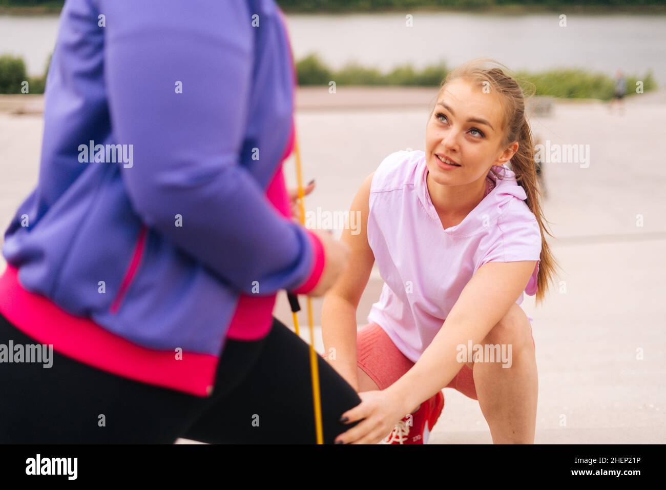 Cropped shot obese overweight young woman doing exercises using fitness ...