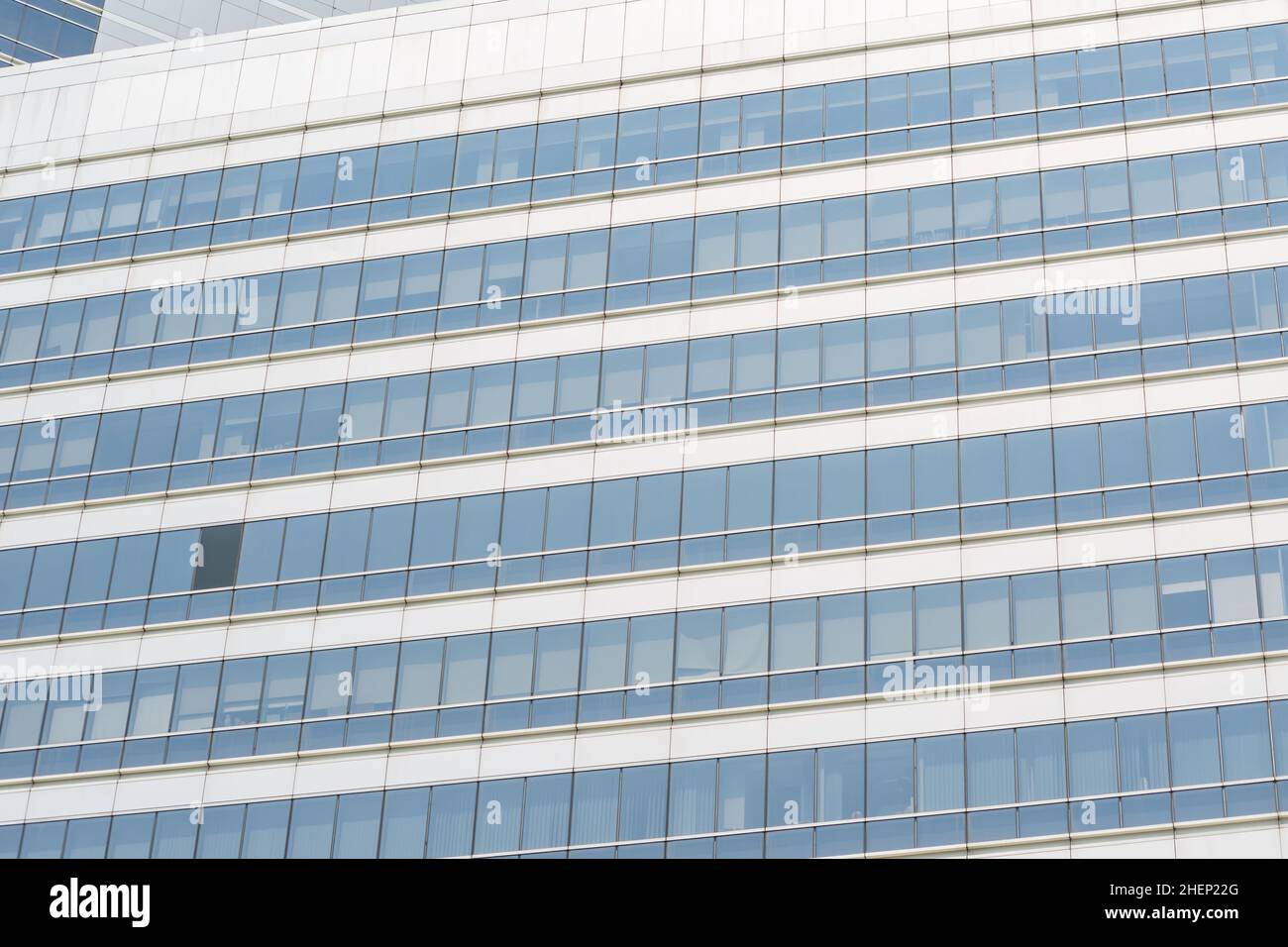 Modern office building with blue glass windows background Stock Photo ...