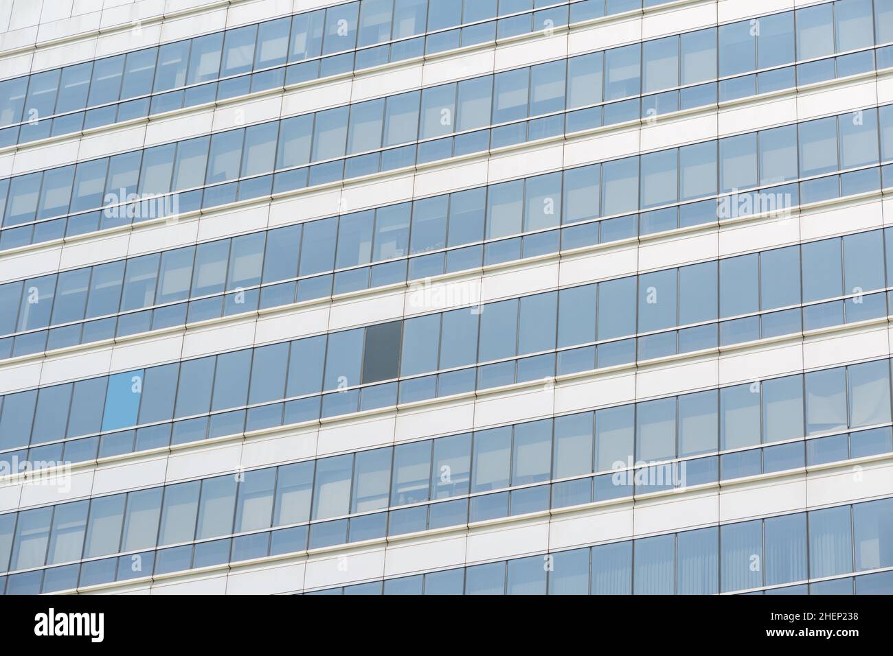 Modern office building with blue glass windows background Stock Photo ...