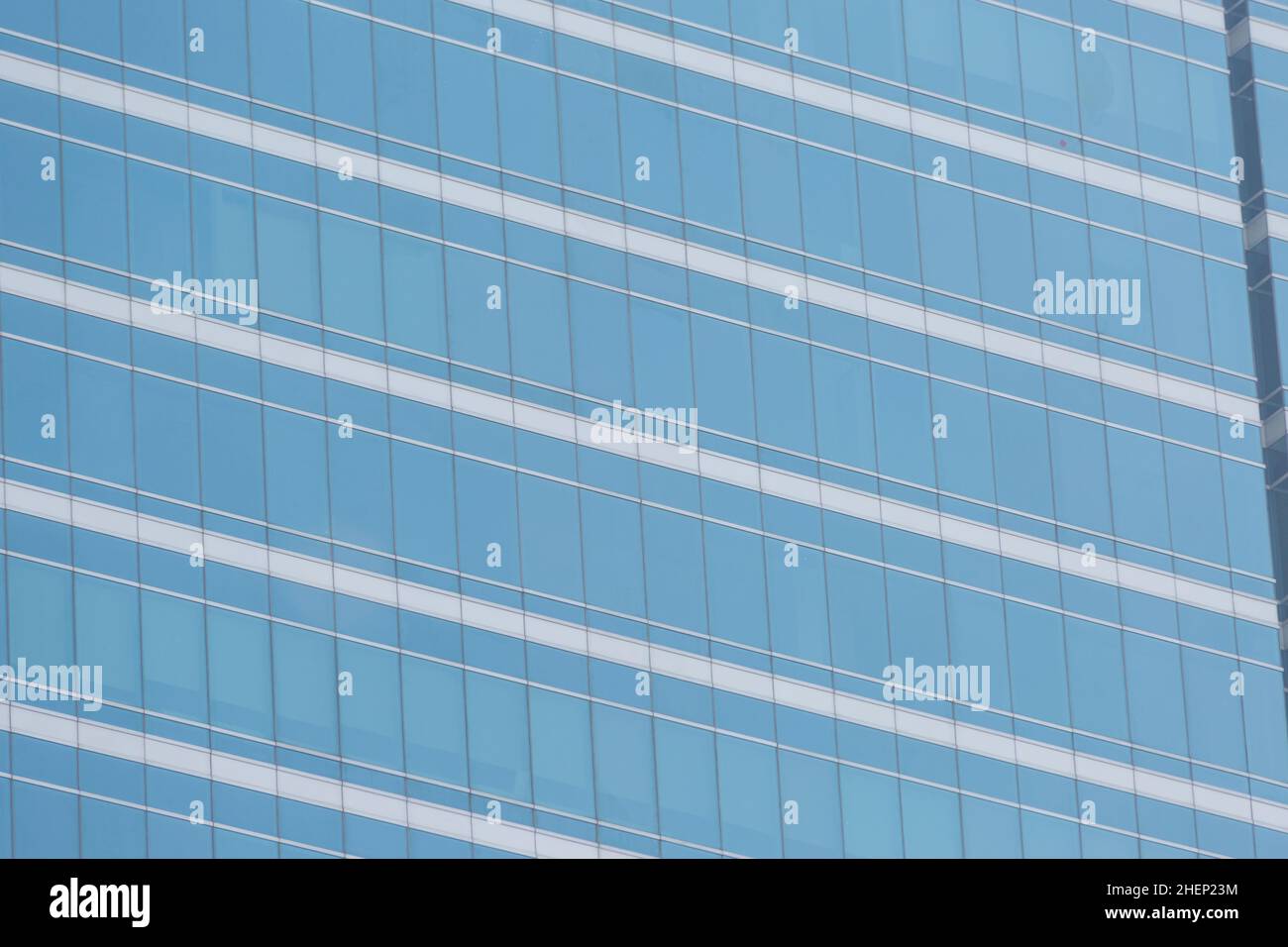 Modern office building with blue glass windows background Stock Photo ...