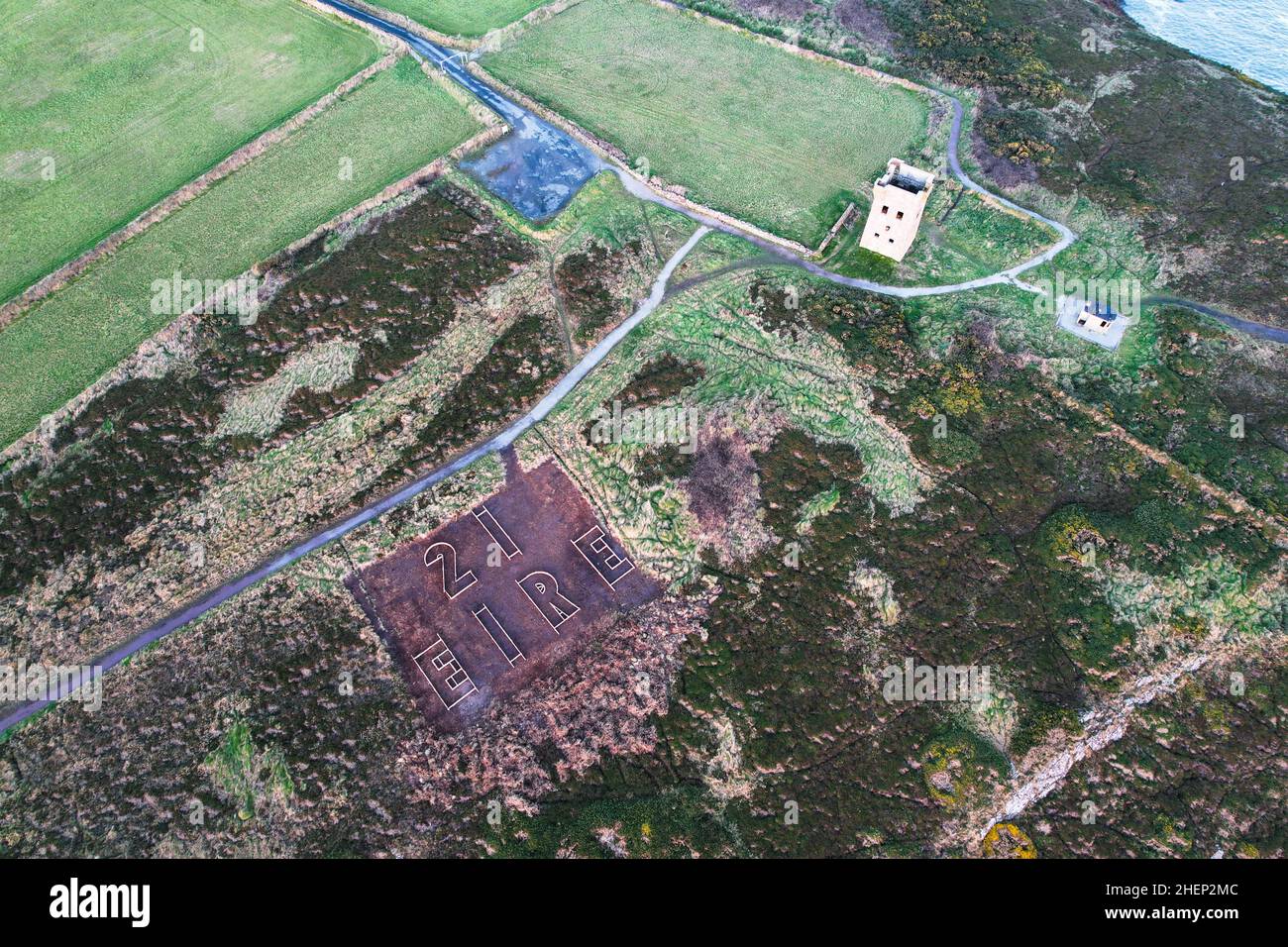 A World War II EIRE sign near Knockadoon Head signal tower and Capel ...