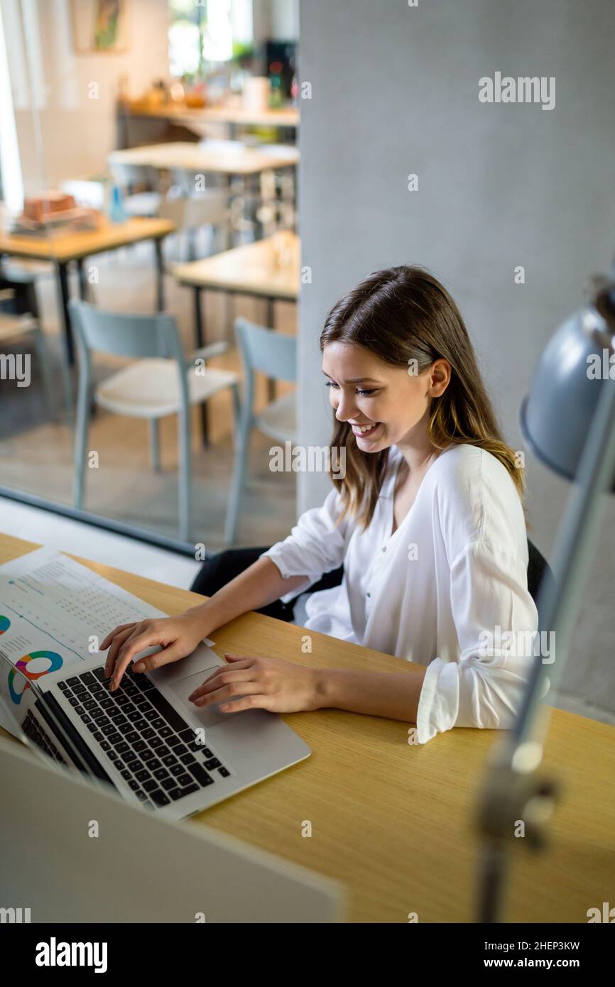 Portrait of happy success young woman working and smiling Stock Photo ...