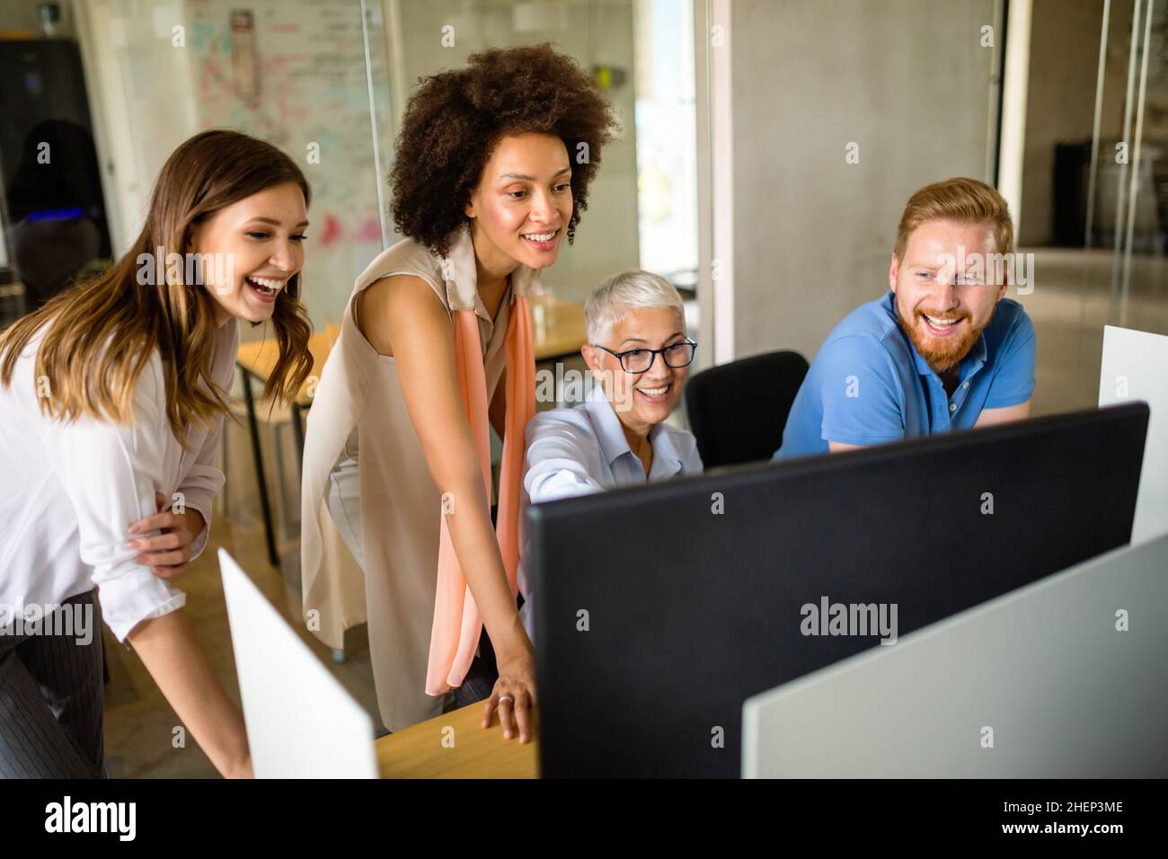 Group of happy multiethnic business people having fun and chatting at ...
