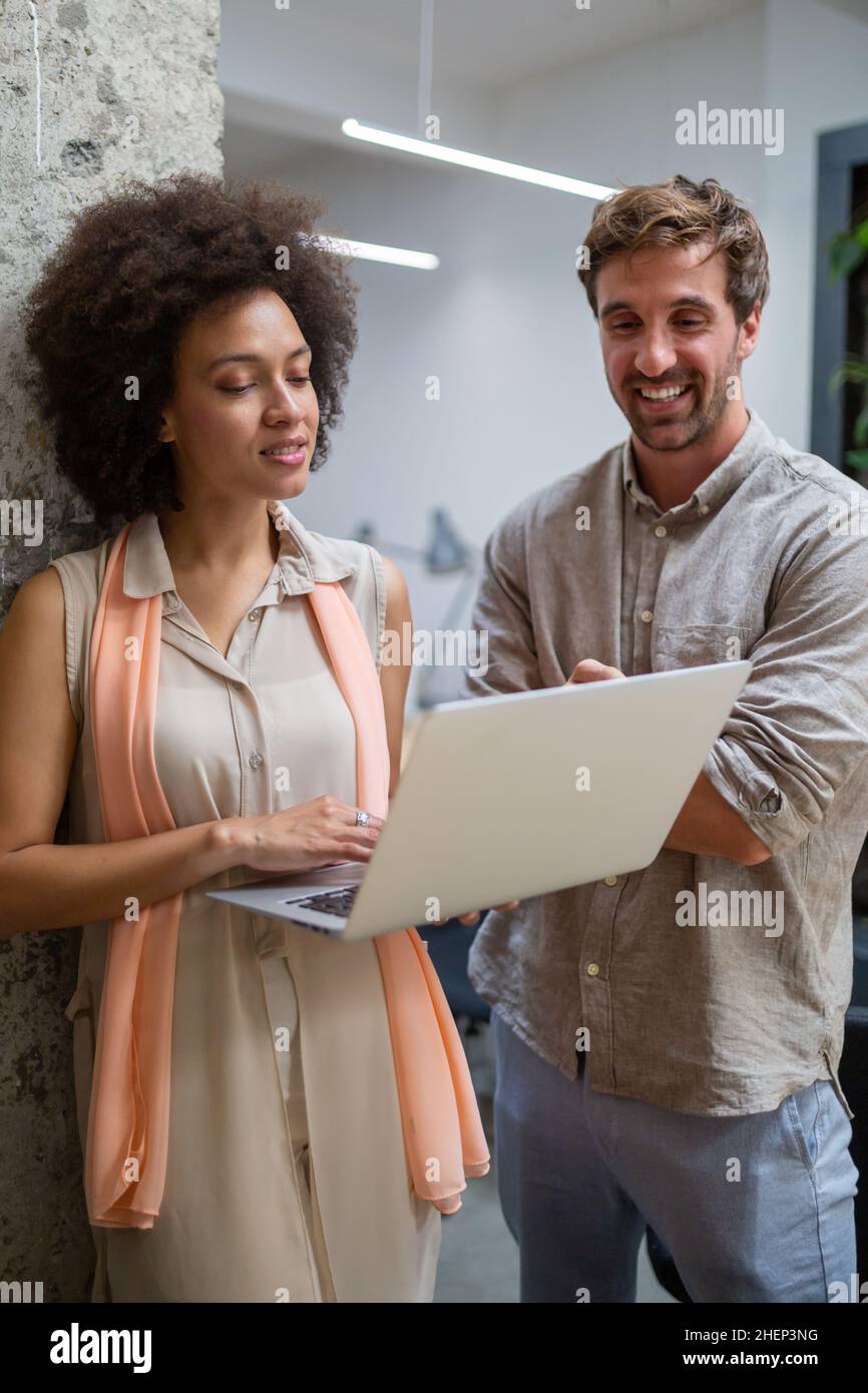 Happy business people having fun and chatting at workplace office Stock ...