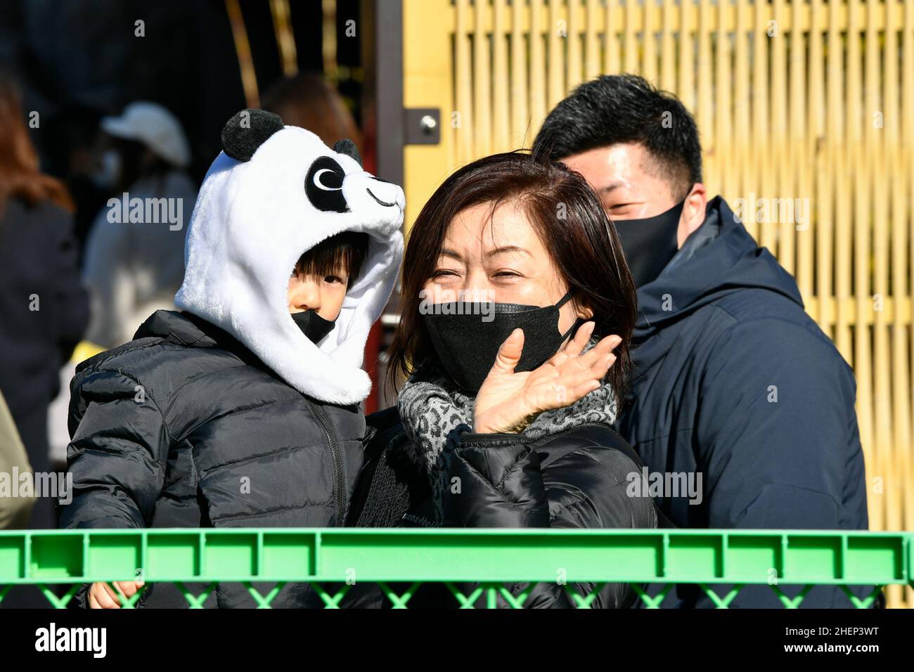 Tokyo, Japan. 12th Jan, 2022. Visitors wait in line to see giant panda cubs at Ueno zoo in Tokyo ...