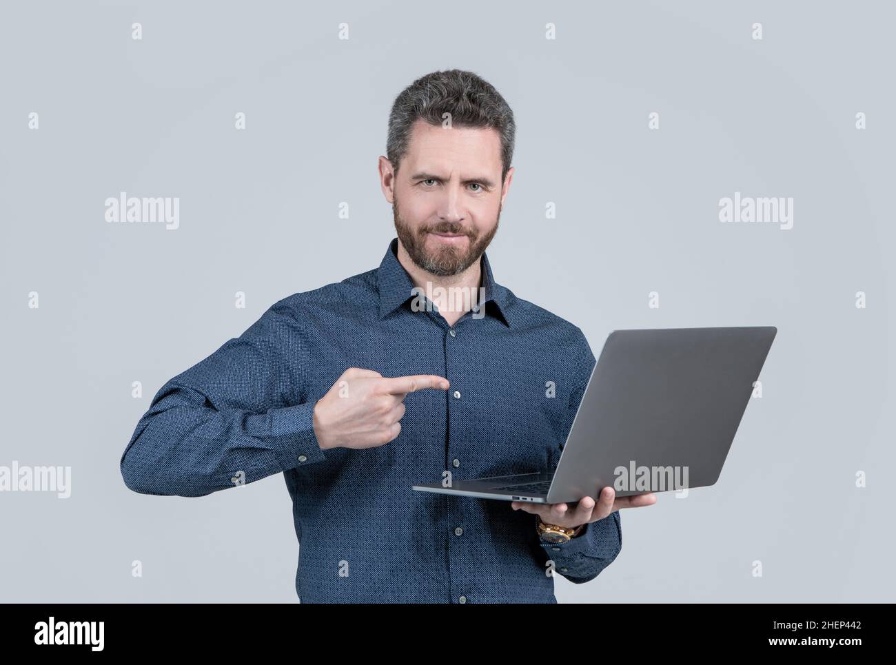 Technology you can trust. Computer engineer point finger at laptop ...