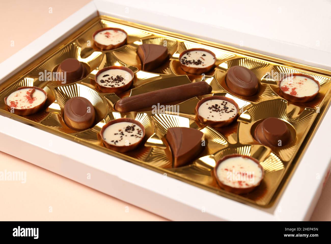 Concept of sweets with chocolate candies on beige background Stock ...