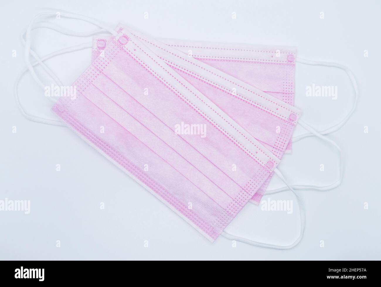 pink face masks isolated on white background Stock Photo - Alamy