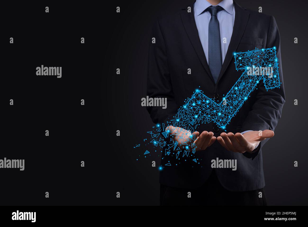 Businessman hold graph, arrow of positive growth icon.pointing at ... Businessman hold graph, arrow of positive growth icon.pointing at ...