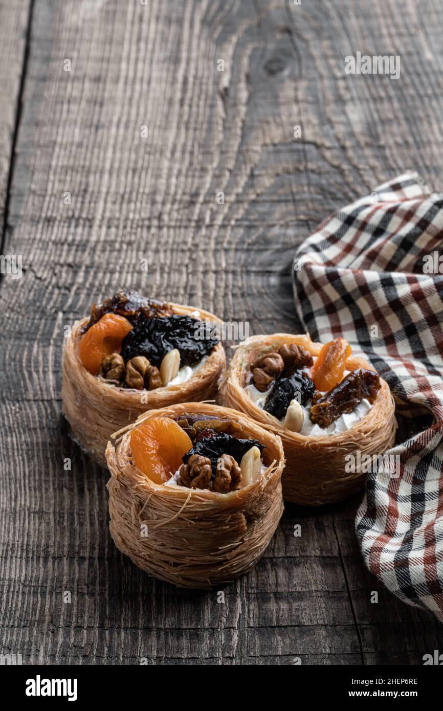 Traditional arabic and turkish sweets pastry dessert kadaif with nuts ...