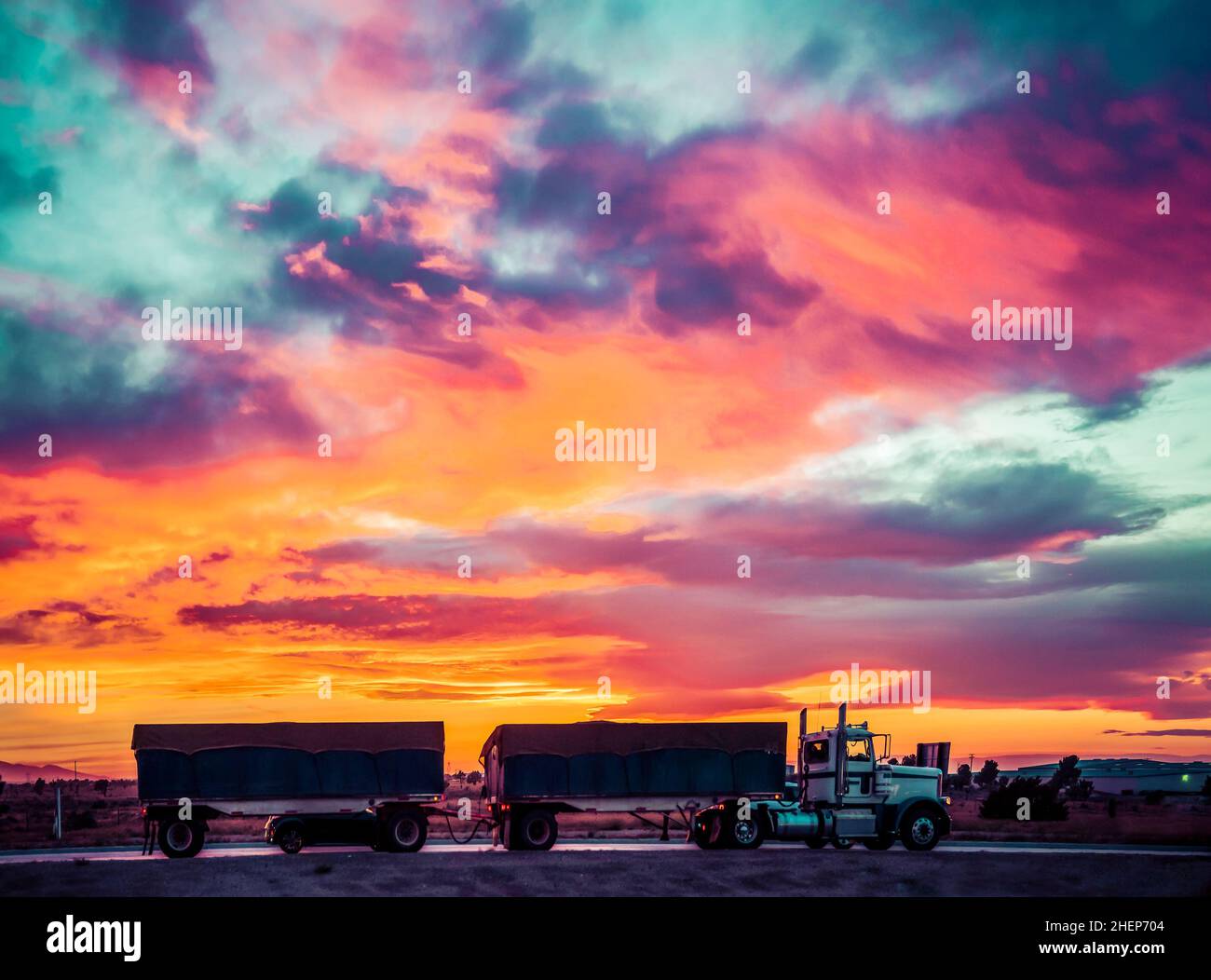 truck on the road with colorful sunset cloudy sky Stock Photo - Alamy