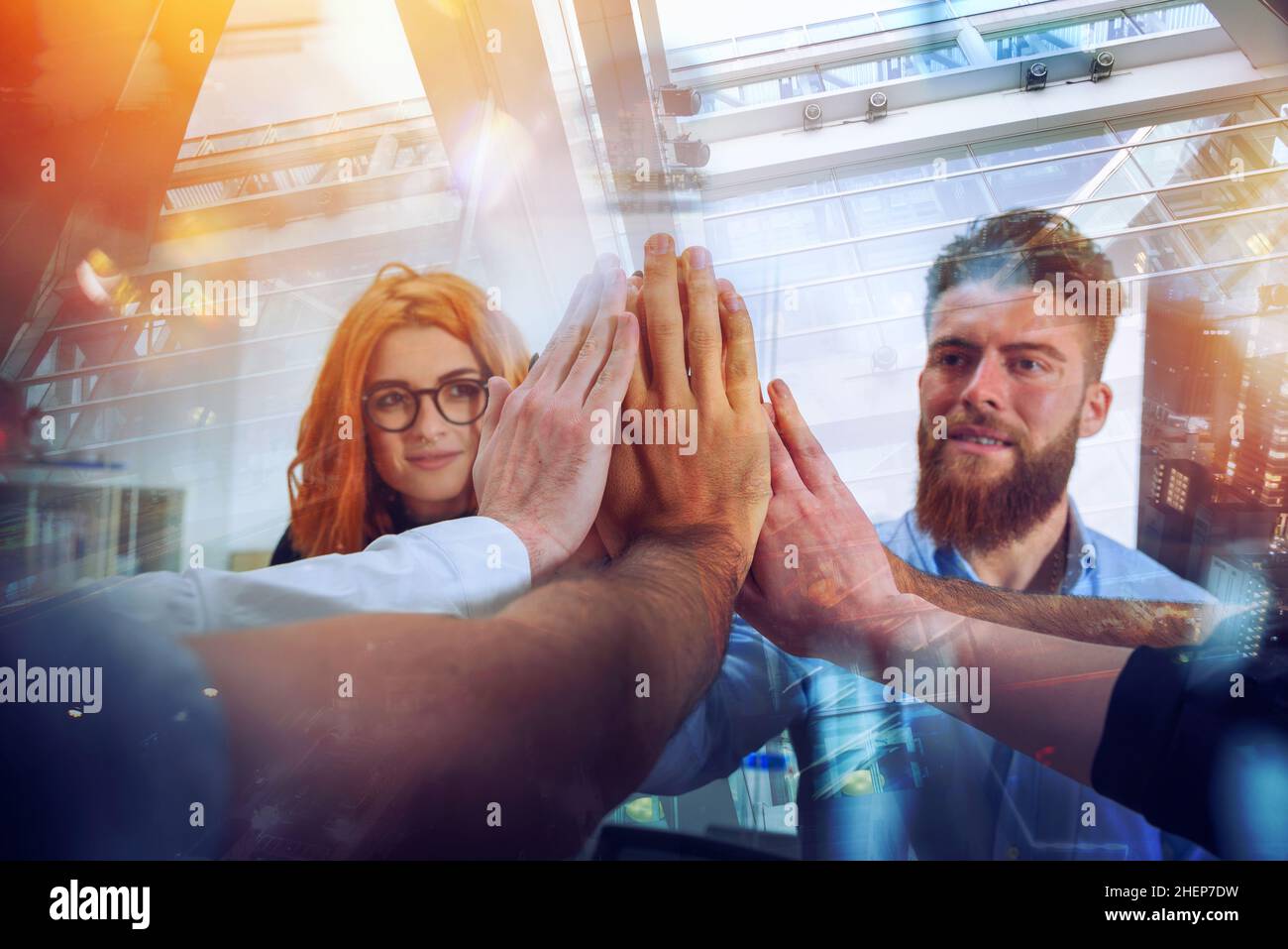 Business people putting their hands together as teamwork and partner ...