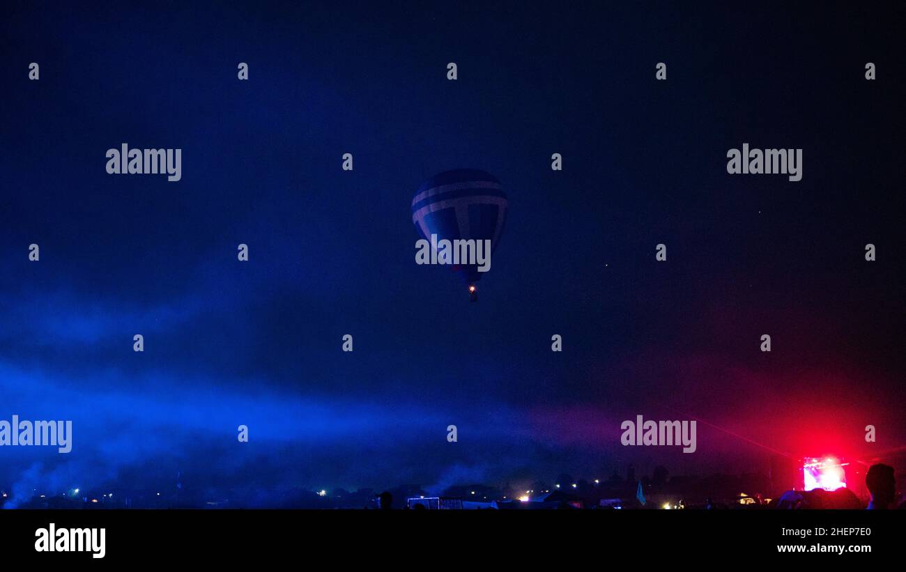 Hot air balloon flying over spectacular Cappadocia under the sky with ...