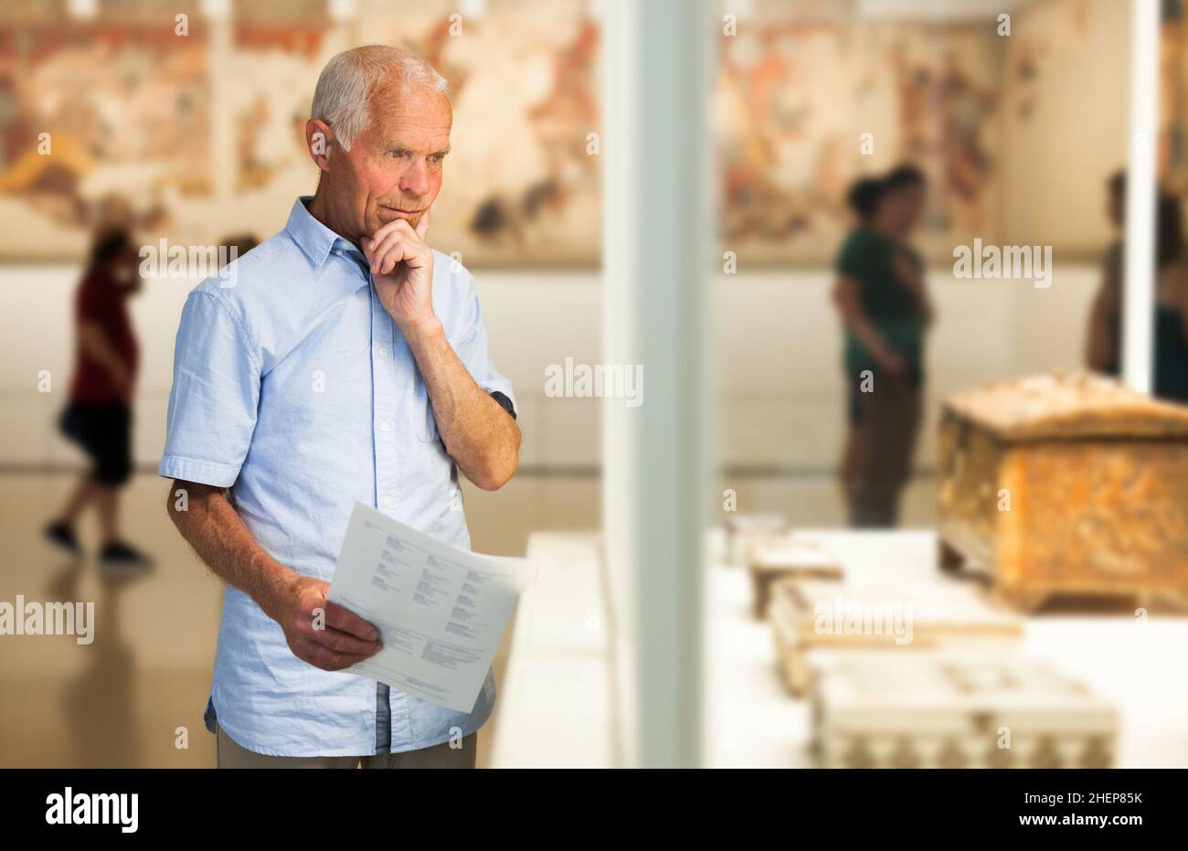 Man exploring artworks in museum Stock Photo - Alamy