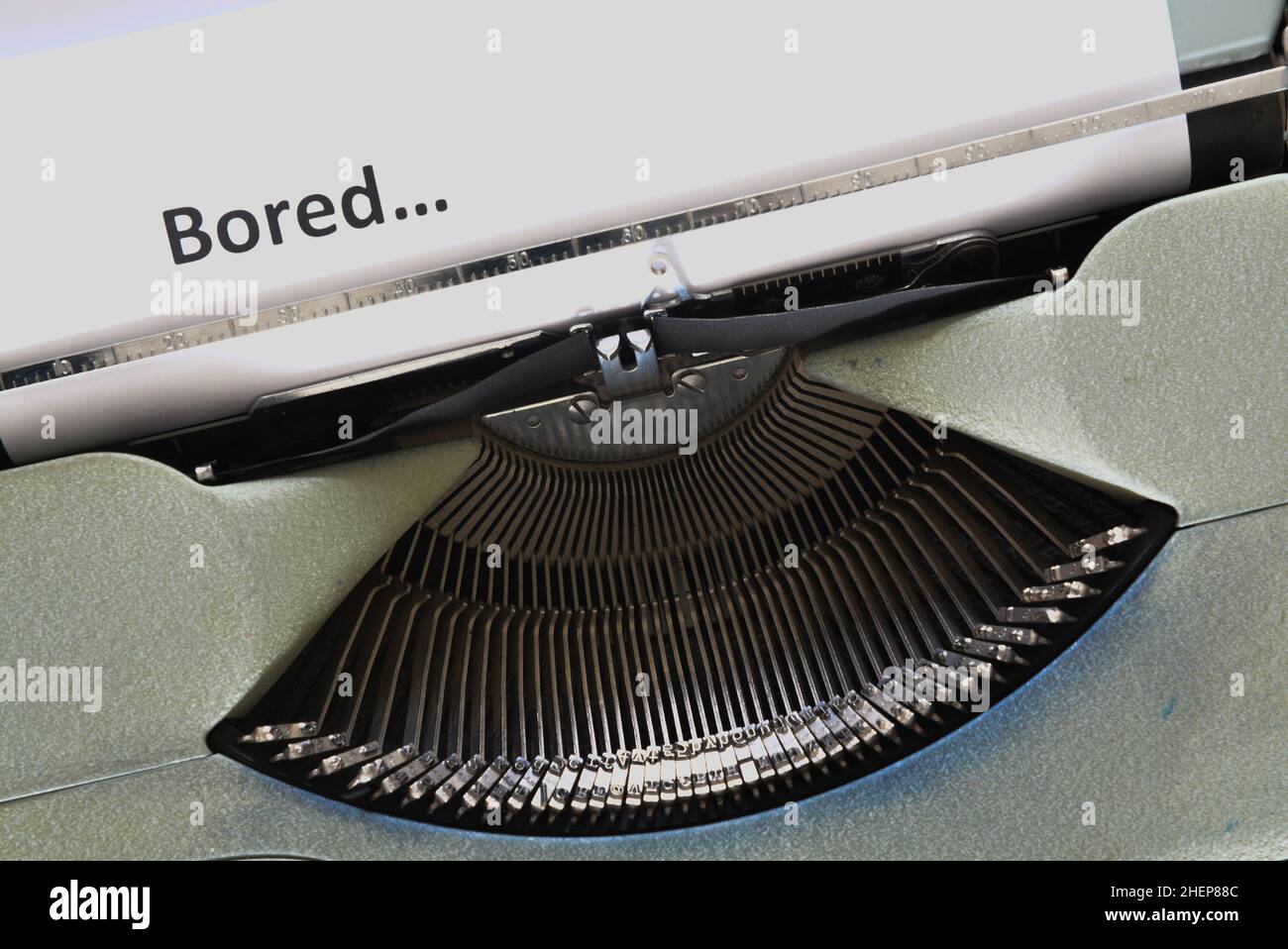 Bored - word typed on white paper held on typewriter platen - keys ...