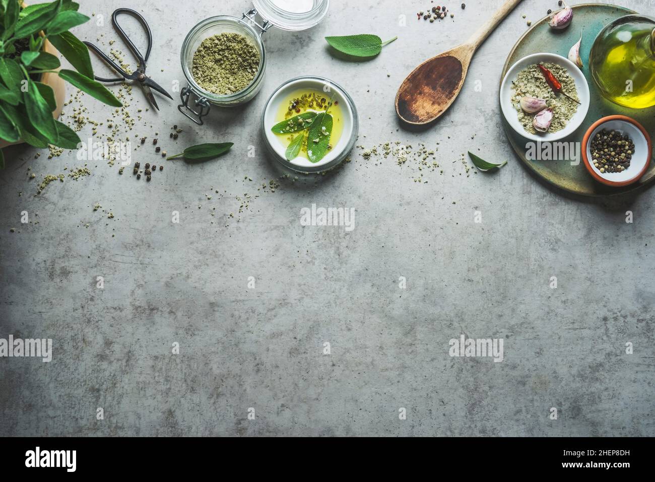 Seasoning background with flavor herbs, spices. herbal salt, olive oil ...