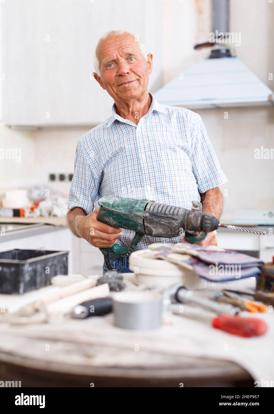 Older man drill diy hi-res stock photography and images - Alamy