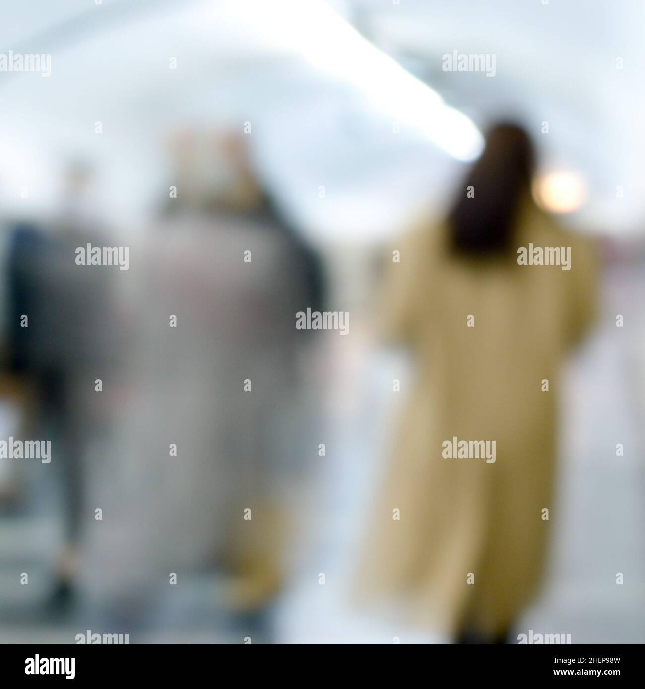 Blurry human silhouette in a subway. Moving human silhouettes in blur ...