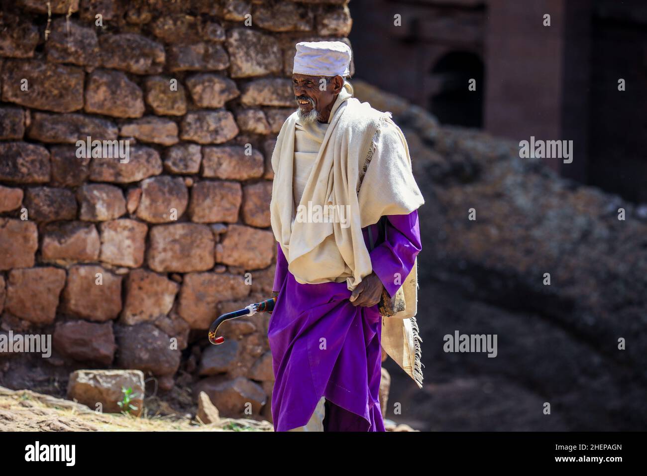 Old Ethiopian Priest in Traditional Clothes going to the Church for ...