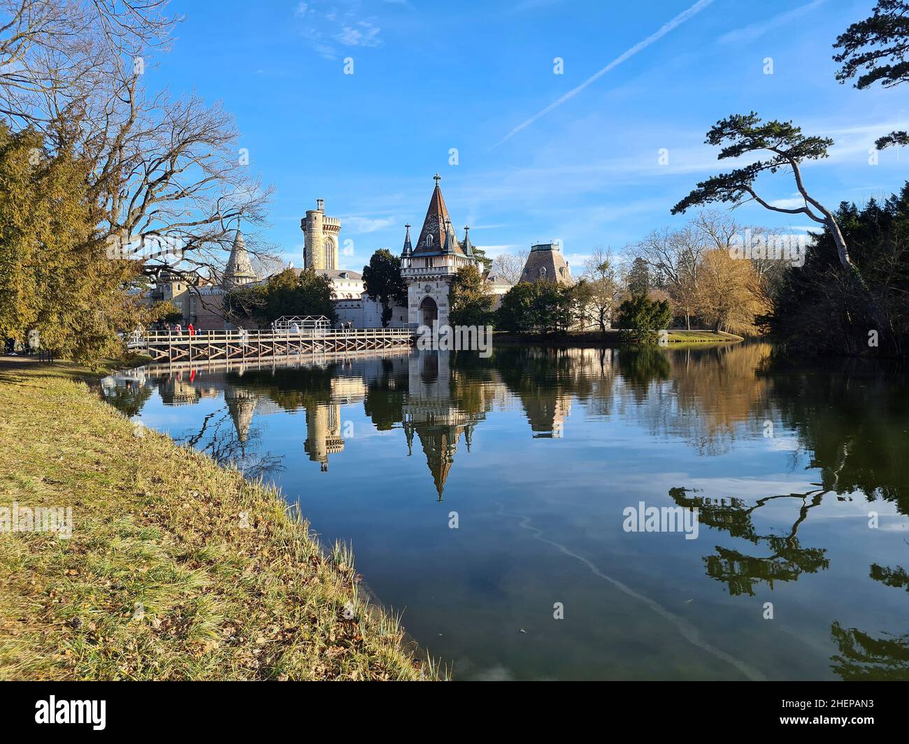 Laxenburg, Austria - January 02, 2022: Castle pond with a walkway for ...