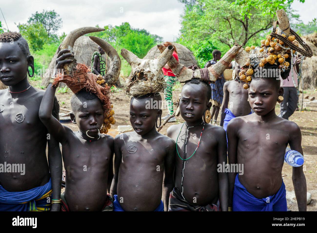 Mursi People Children in National Costumes in the Tribe Village Stock ...