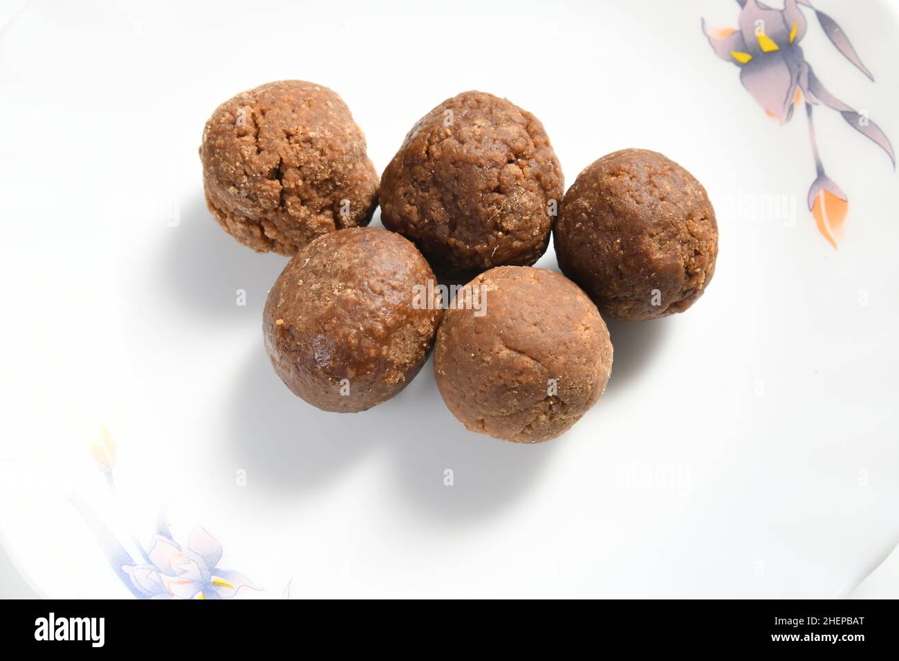 Coconut laddu. Traditional semi-fried Indian sweet made of coconut and ...