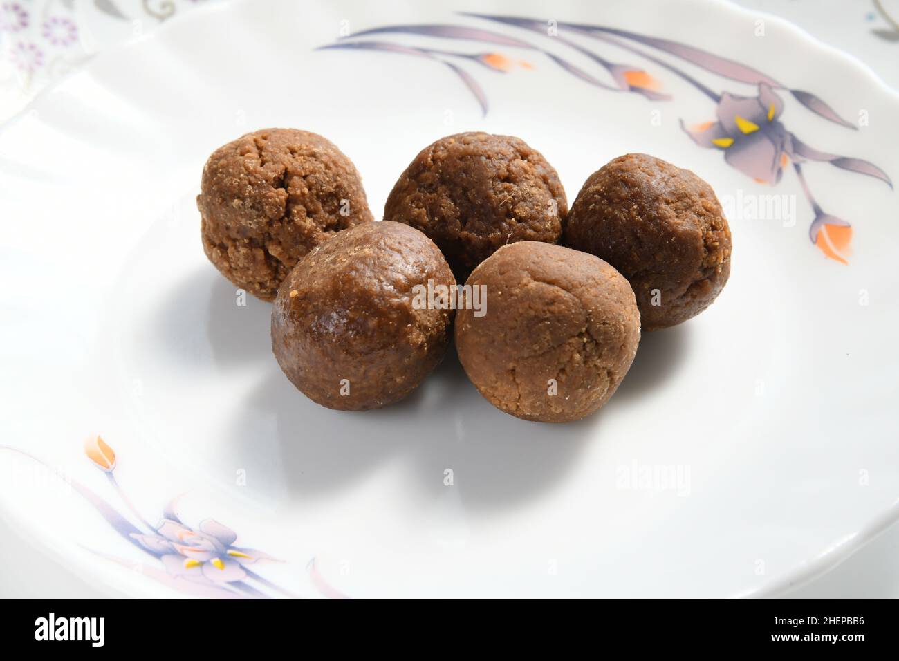 Coconut laddu. Traditional semi-fried Indian sweet made of coconut and ...